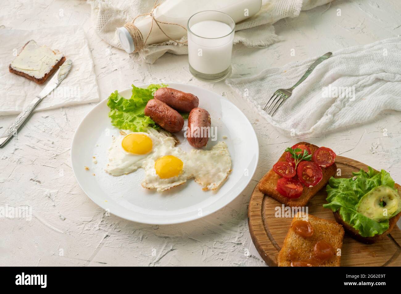 morning meal concept, table with milk with eggs and nutritious sandwich ...