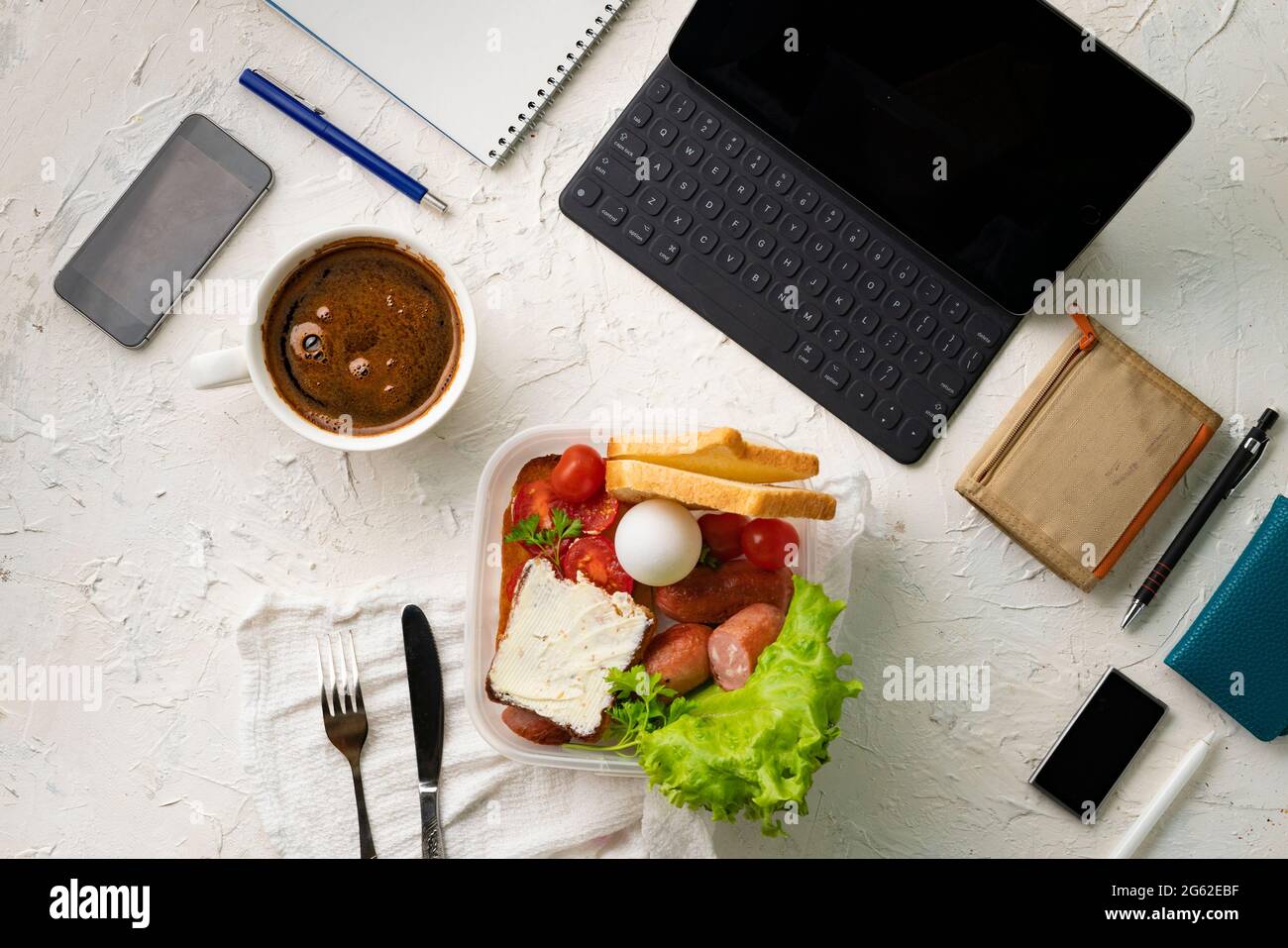 top view of the office work place with computer or laptop pen and phone ...