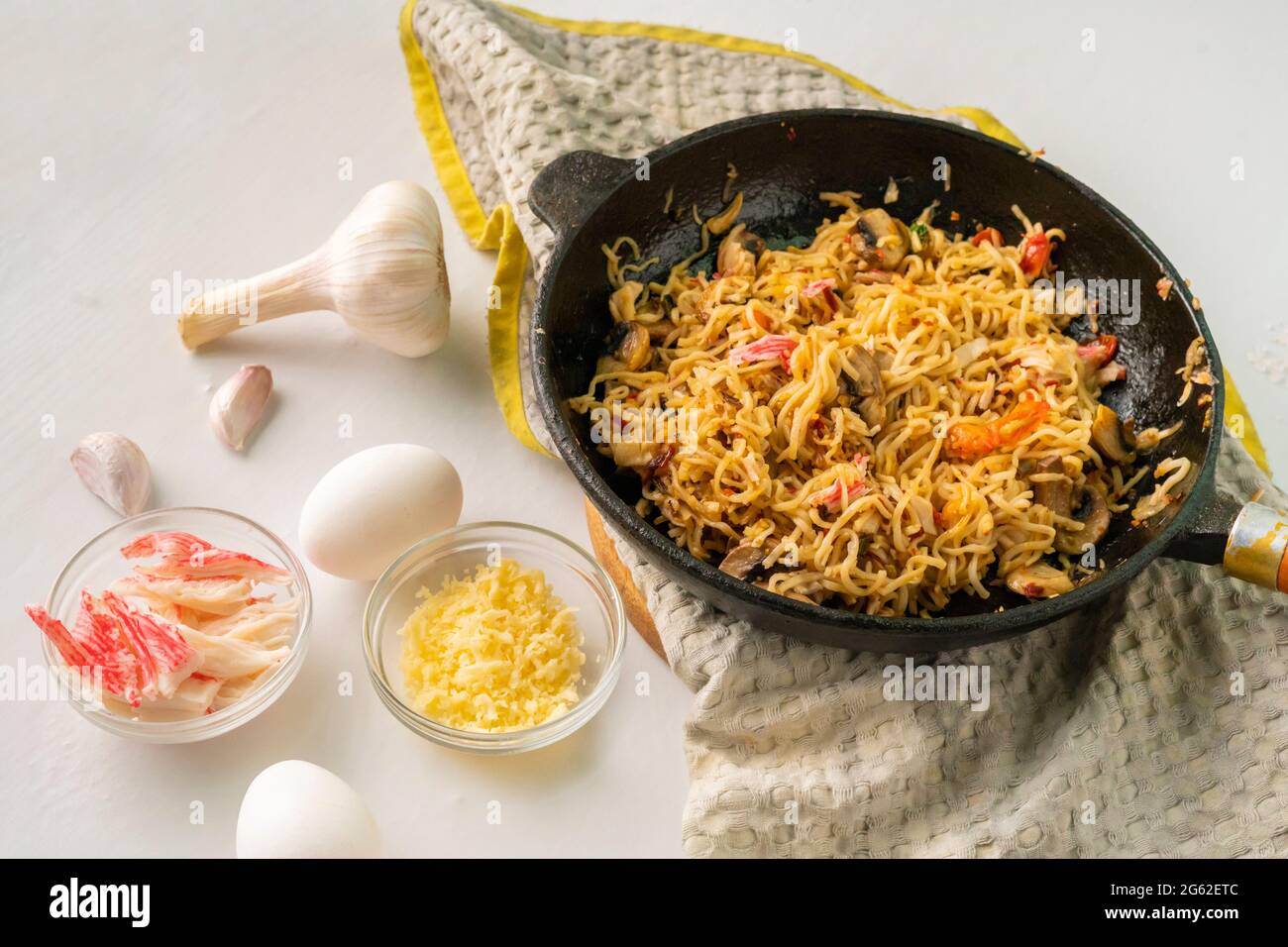 hot carbonaro paste in a pan with spices and ingredients on the table ...