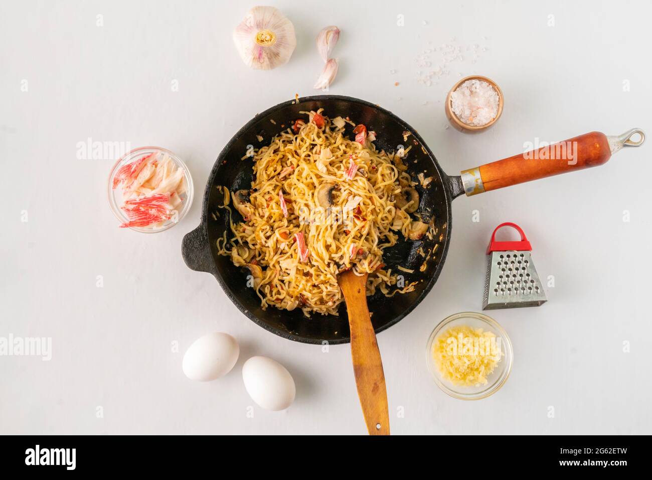hot carbonaro paste in a pan with spices and ingredients on the table ...