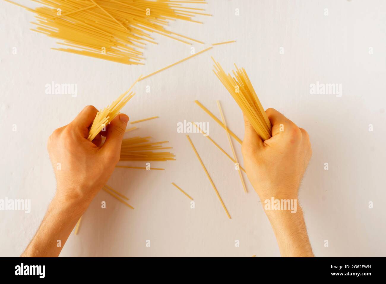Breaking spaghetti noodles hi-res stock photography and images - Alamy