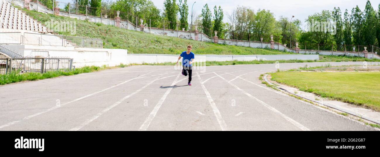 fast speed runner on the stadium sport track outdoor before the ...