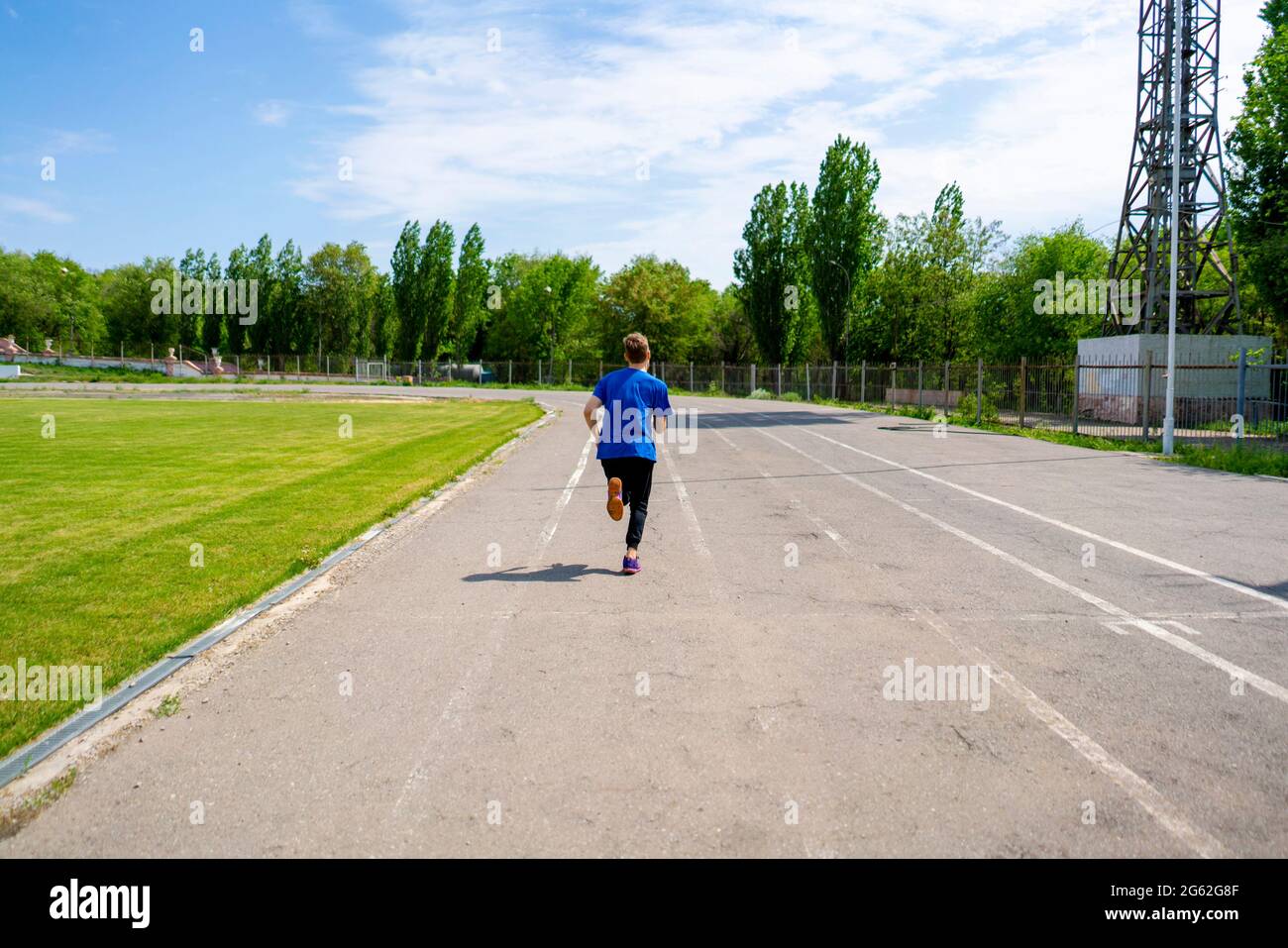fast speed runner on the stadium sport track outdoor before the ...