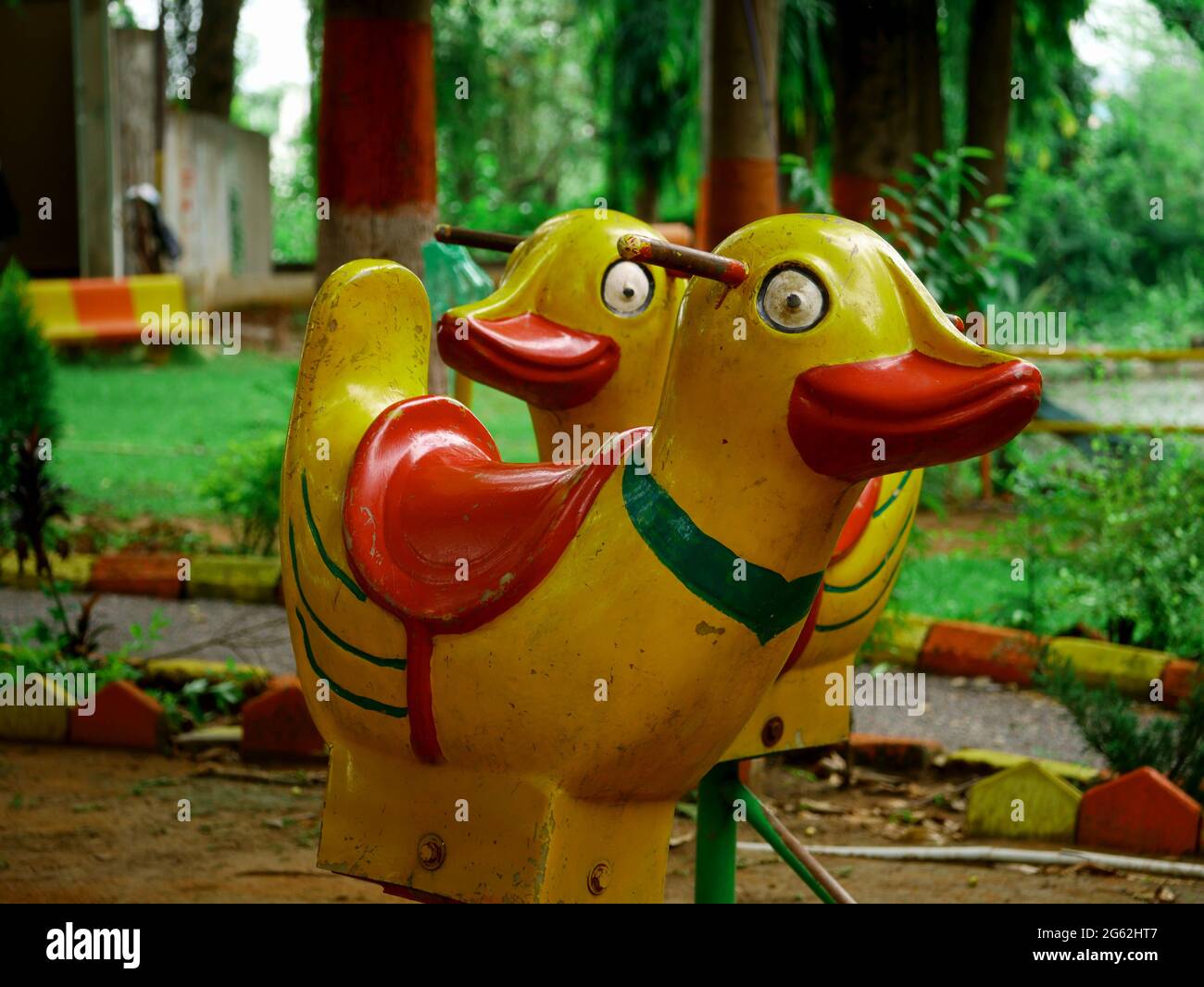 Cartoon duck chair swing for kids playing presented on green park ...