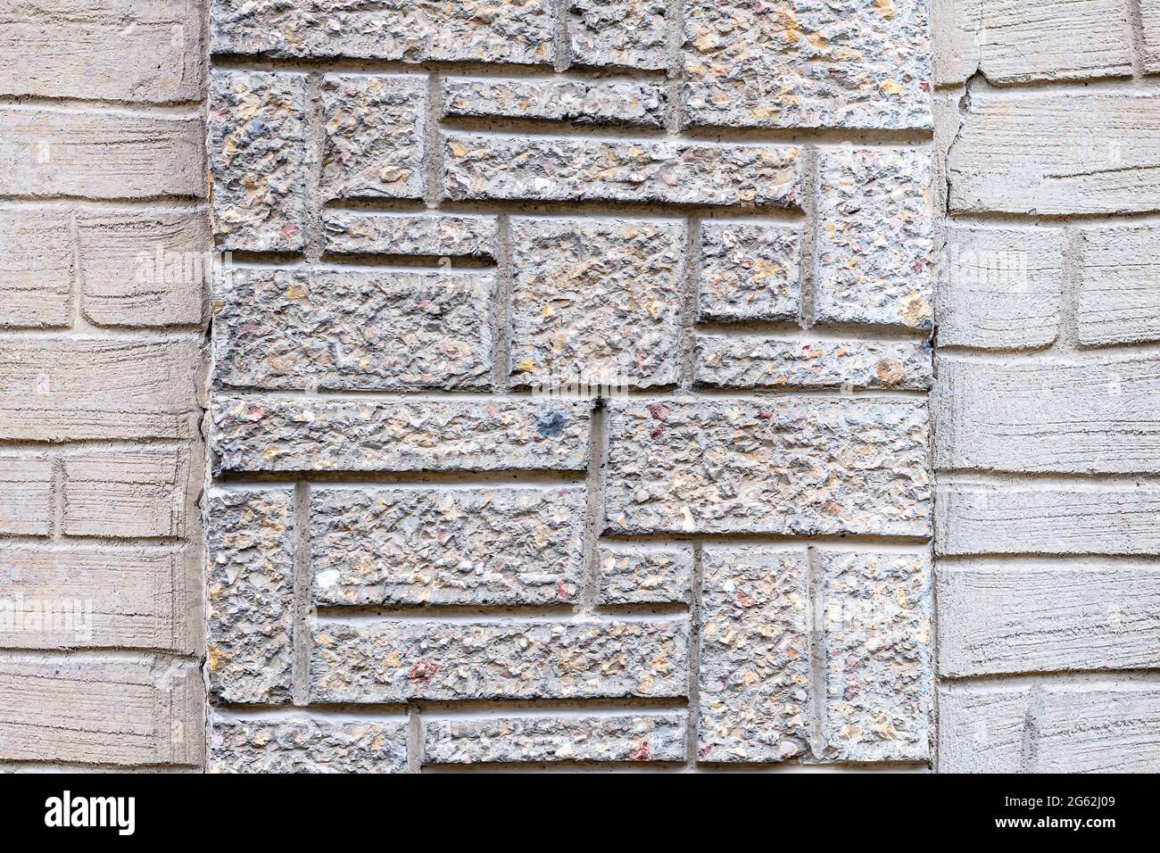 Exterior photograph of a stone and brick facade of a house.The photo ...