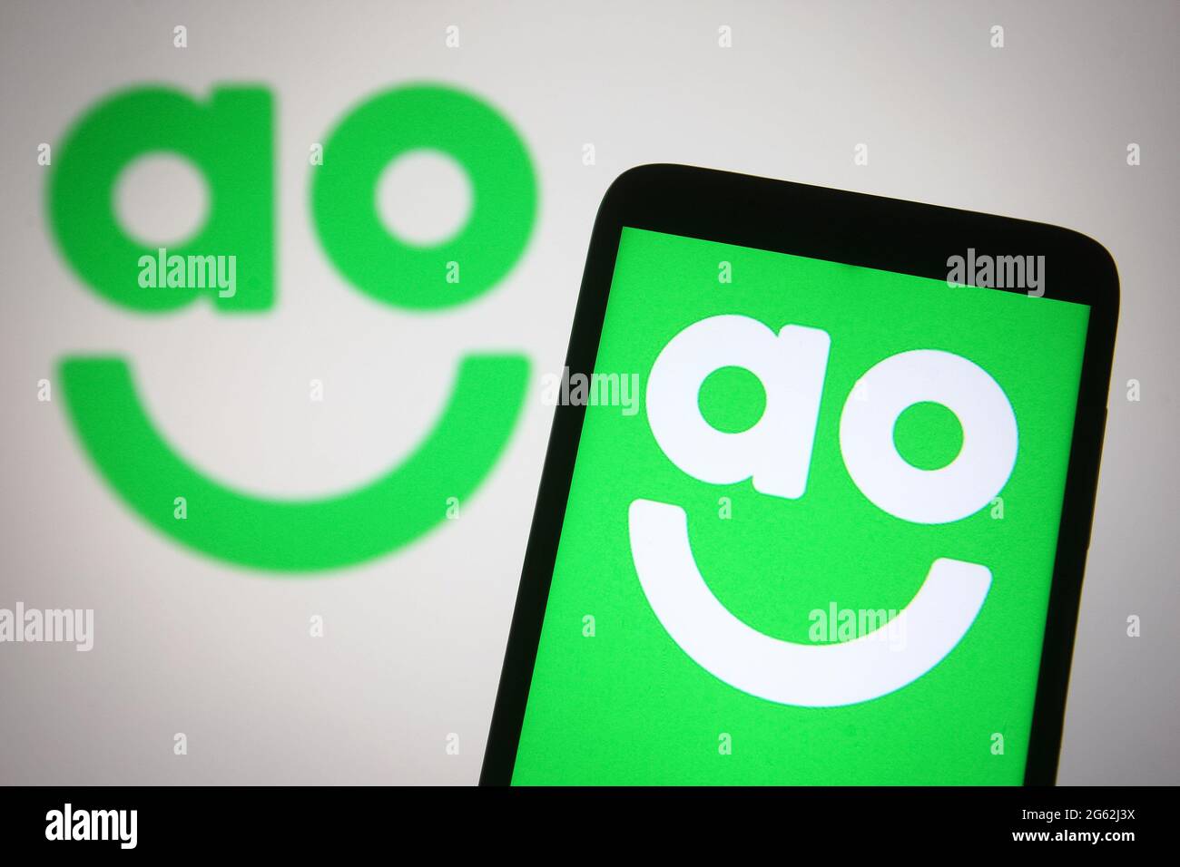 In this photo illustration an AO World logo of an electrical retailer ...