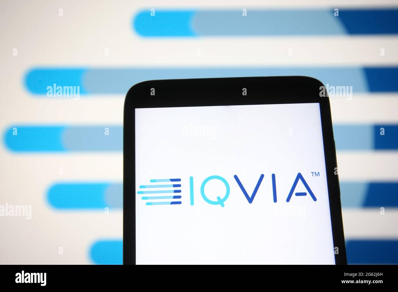 In this photo illustration the IQVIA logo is seen on a smartphone ...