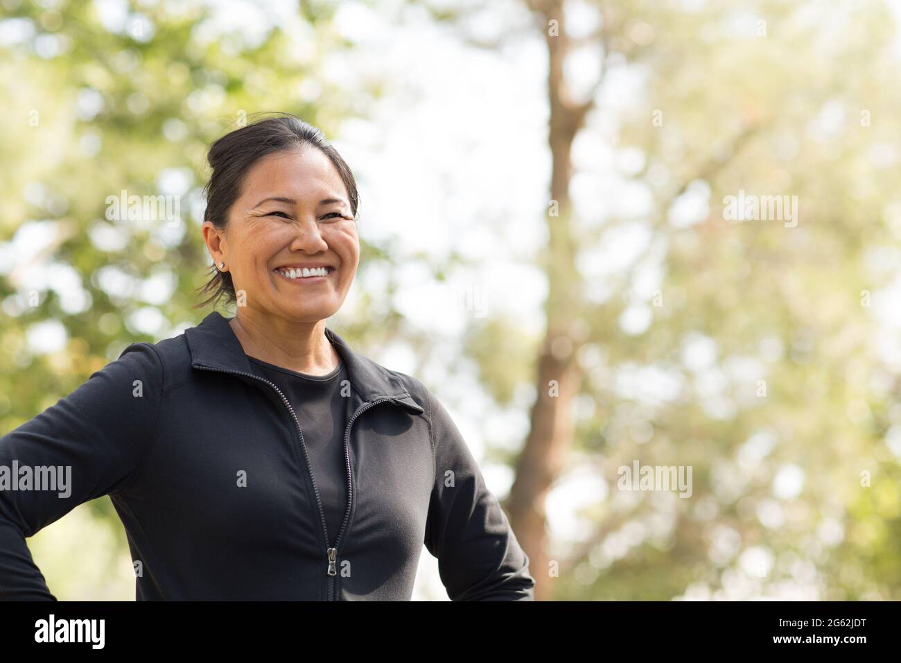 Portrait of a fit Asian woman exercising Stock Photo - Alamy