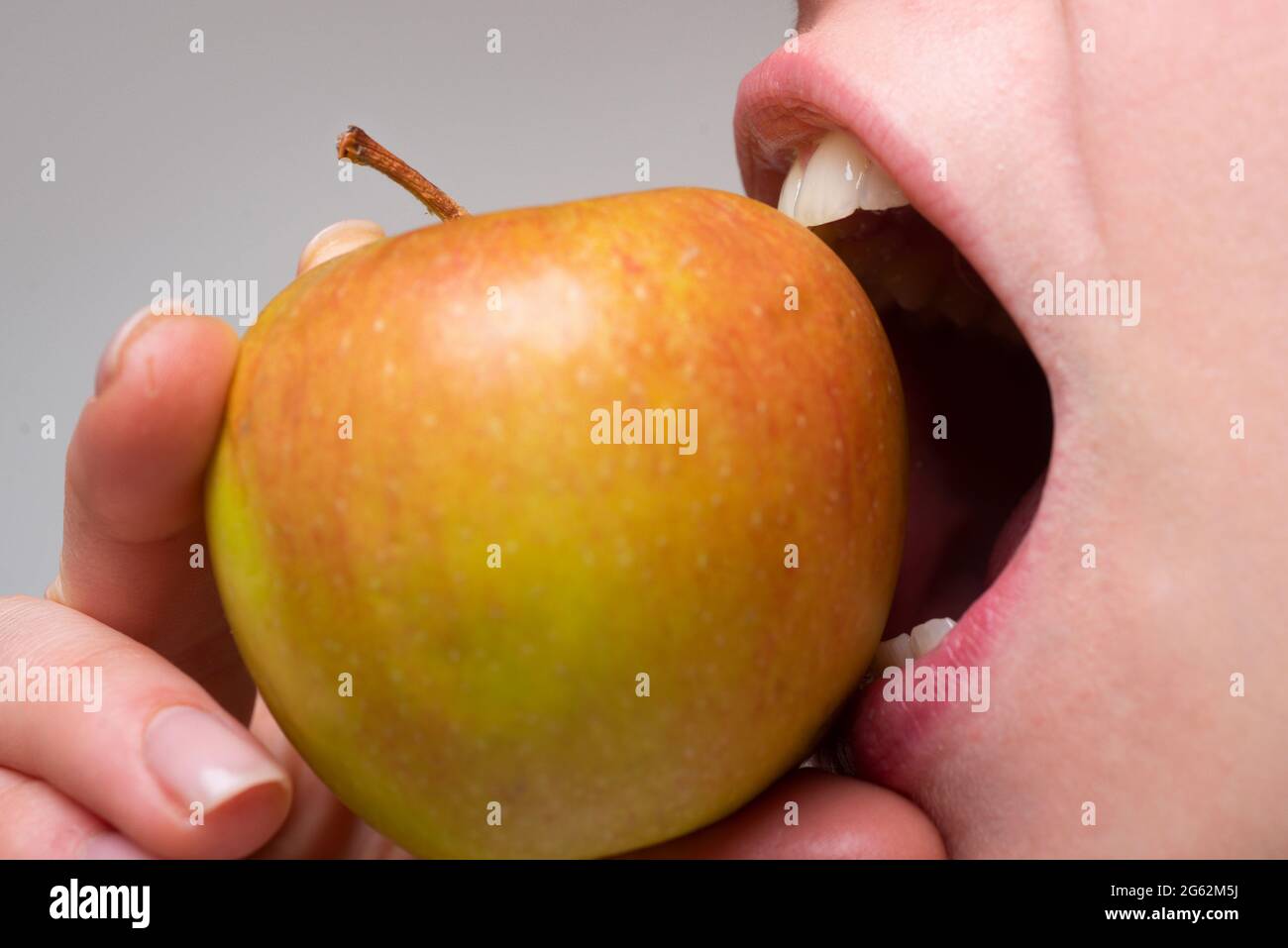 Healthy happy woman eating apple close macro. Biting an apple. Mouth ...