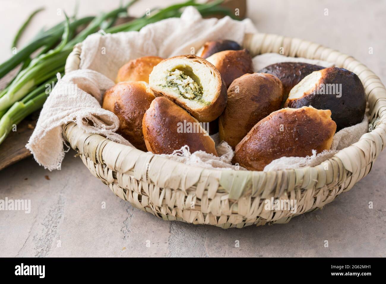 Russian pastries (pirogi) filled with eggs and green onion Stock Photo ...