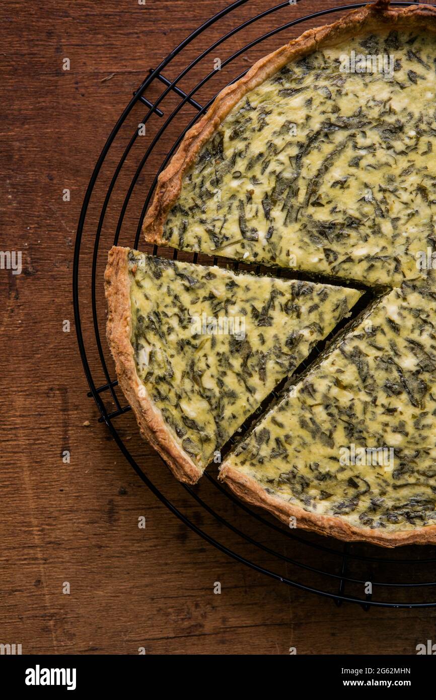 Quiche with spinach - traditional dish of french cuisine. Spinach tart ...