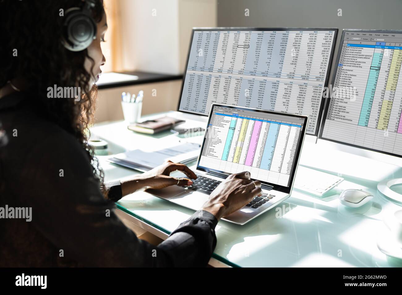 Data Analyst African Woman Using Spreadsheet On Computer Stock Photo ...