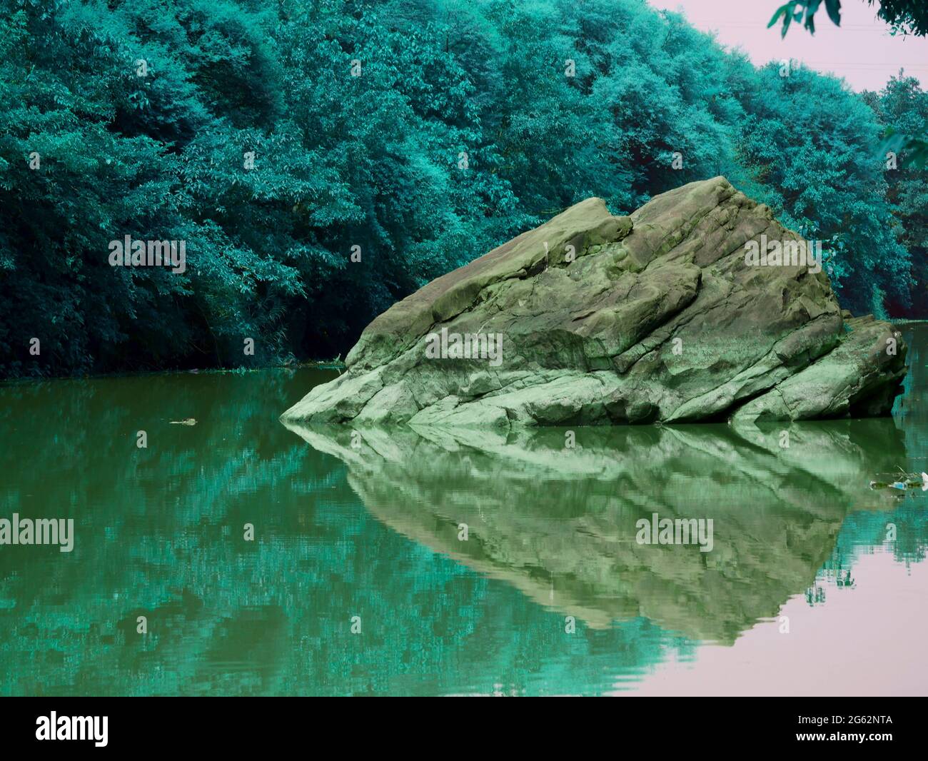 Extreme big stone rock water reflection image presented at river nature ...