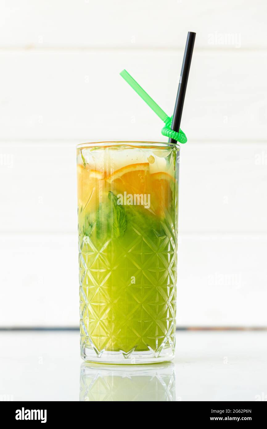 Citrus lemonade on white wooden background close up Stock Photo - Alamy