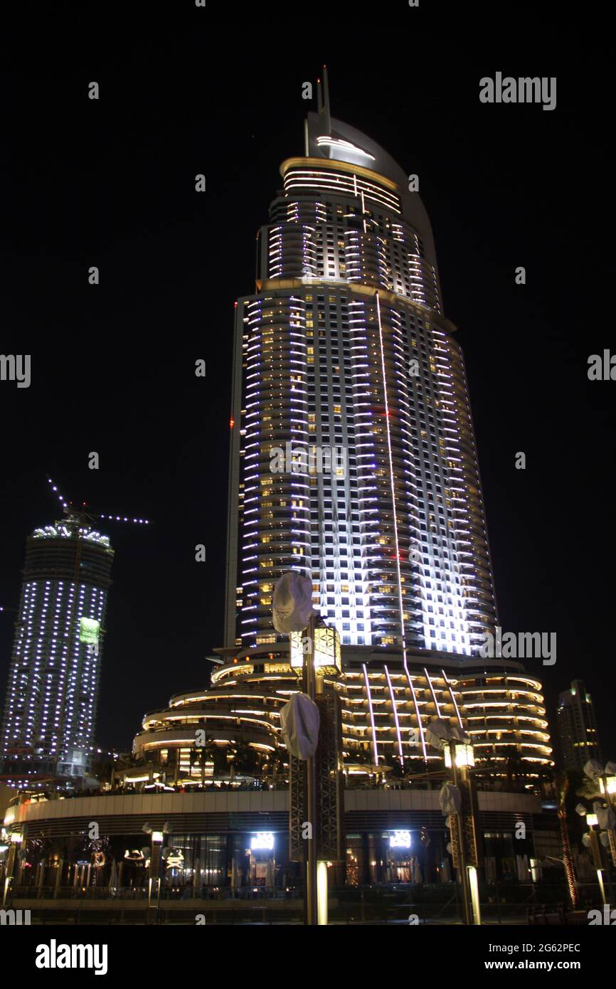 A beautiful high rise building with unique architecture and lighting in ...