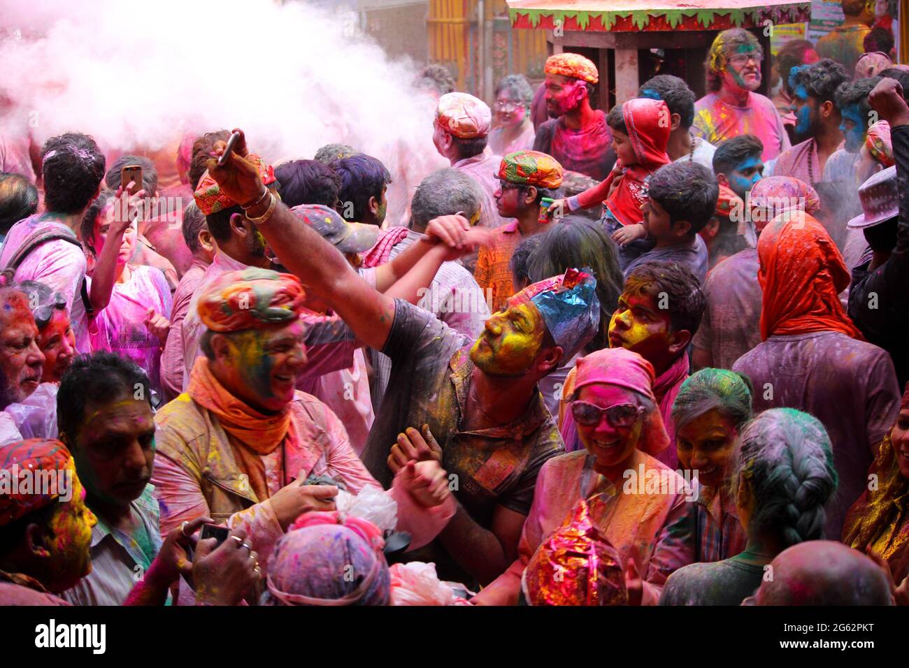 People celebrating Holi festival in India using colorful powder Stock ...