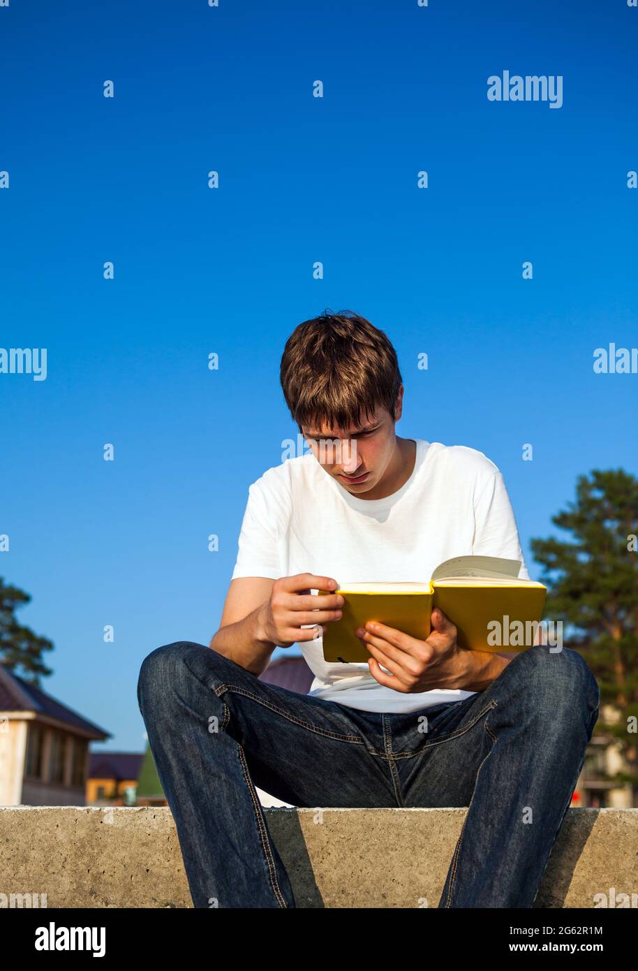 Young guy opened book hi-res stock photography and images - Alamy