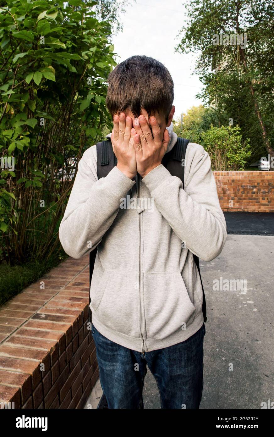 Sad Young Man standing on the City Street Stock Photo - Alamy