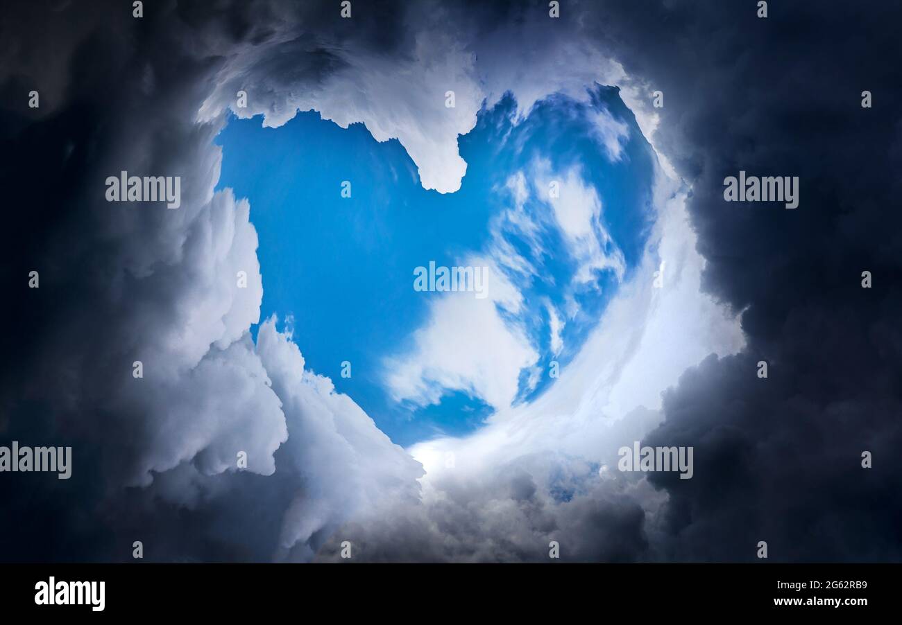 Heart Shape with Blue Sky in the Dramatic and Storm Clouds Stock Photo ...