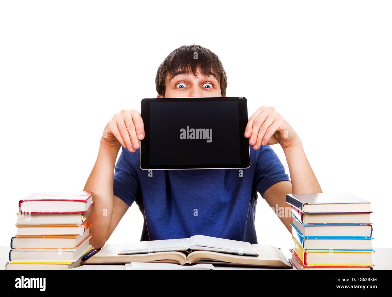 Surprised Student show the Tablet Computer on the School Desk Stock ...