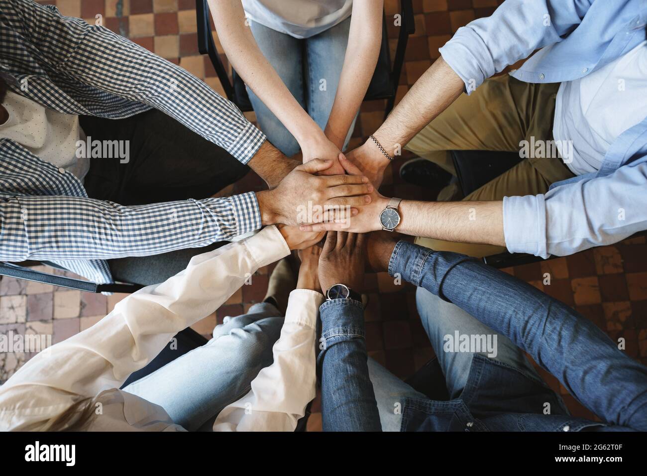 Top view of diverse people hands holding together in circle, hands ...