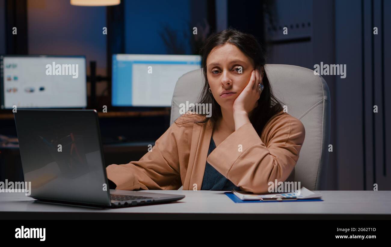 Portrait exhausted workaholic manager checking hi-res stock photography ...