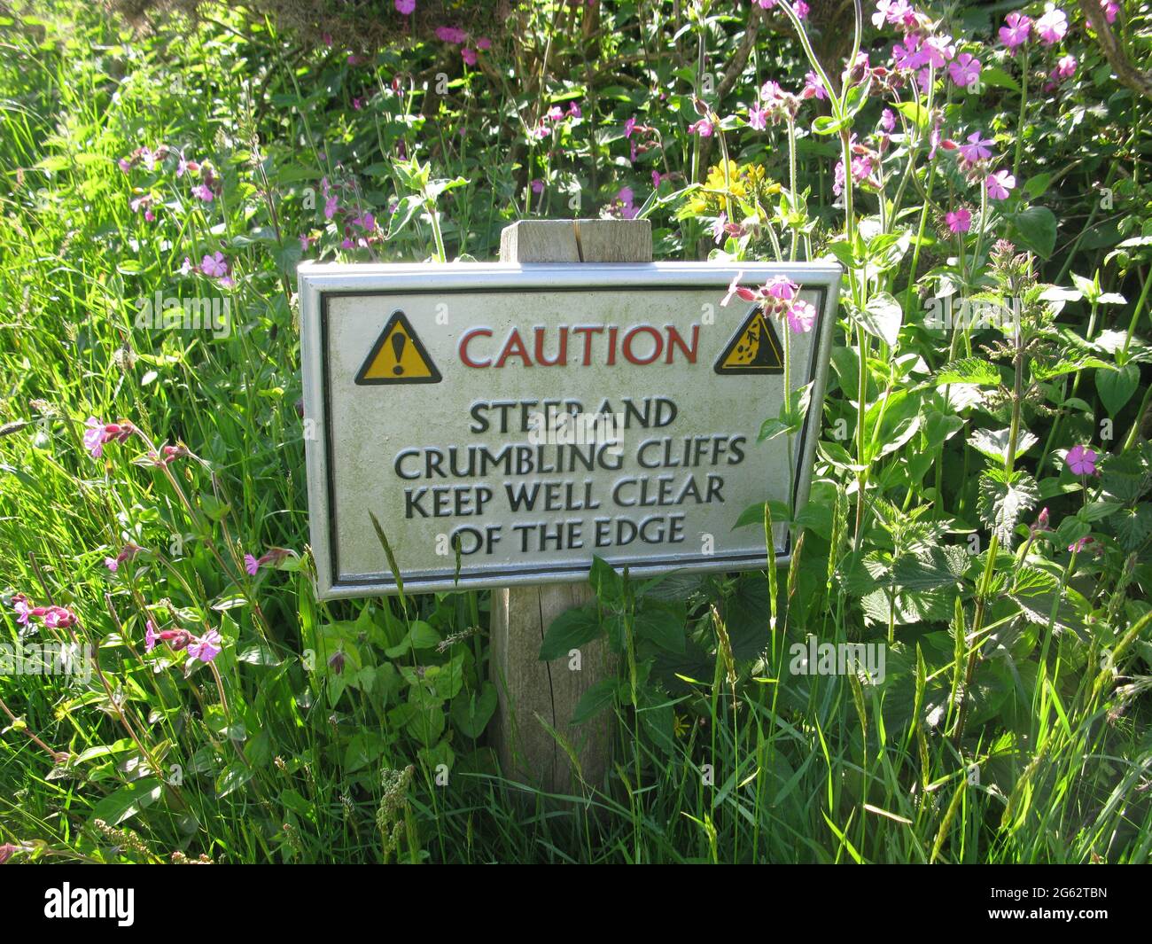 Caution steep and crumbling cliffs keep well clear of the edge sign ...