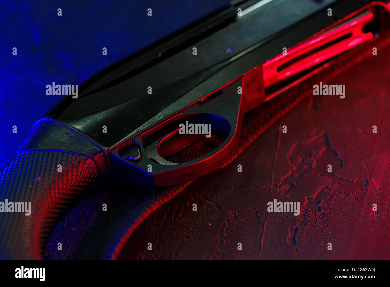Hunting shotgun on black background with red and blue backlight Stock ...