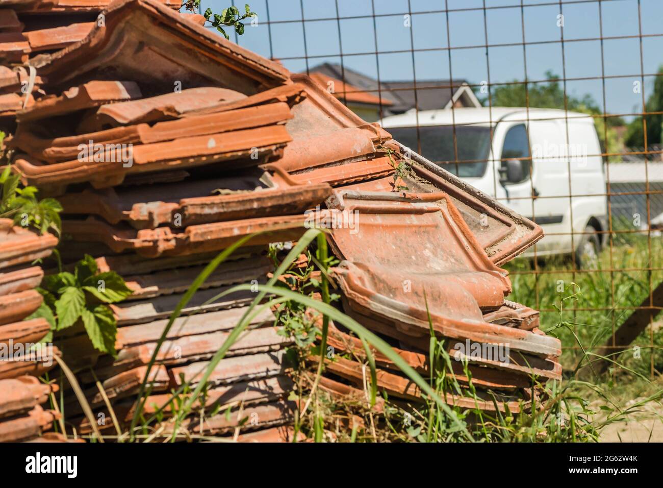 A pile of old tiles, removed from the roof of the house Stock Photo - Alamy