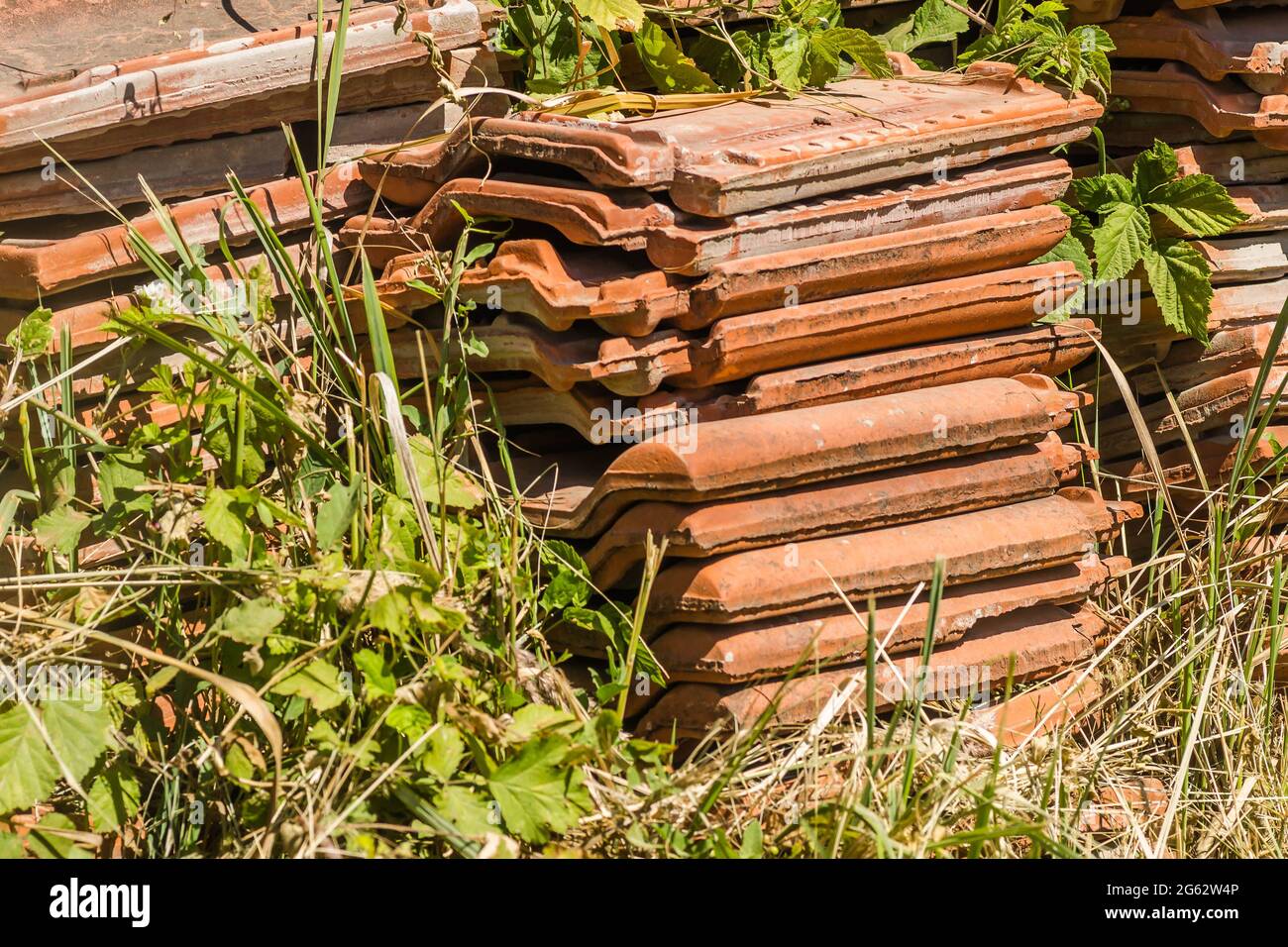 A pile of old tiles, removed from the roof of the house Stock Photo - Alamy