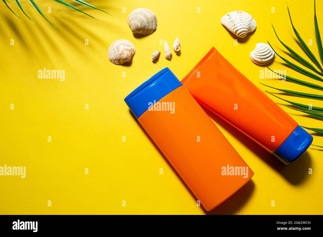 Two tubes with mock up sunscreens on a yellow summer background. UV ...