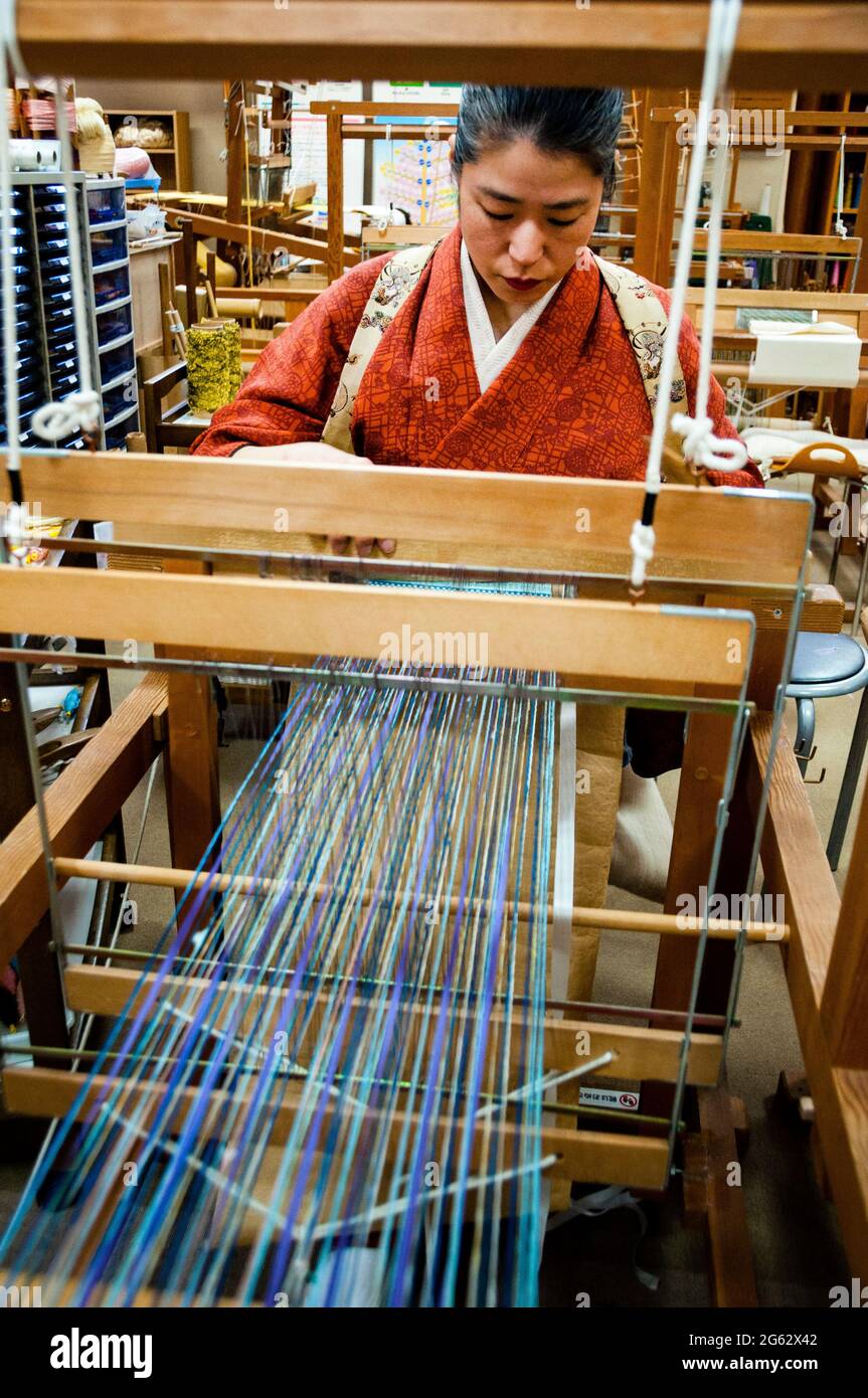 Textile weaver at Nishijin Textile Center in Kyoto manufactures ...