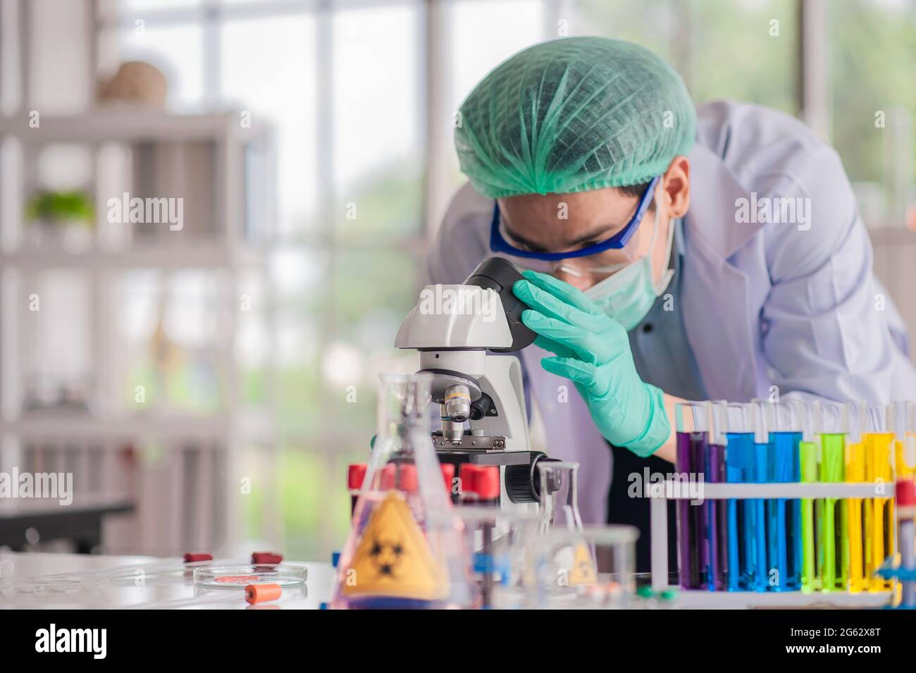 Close up Doctor using microscope in hospital lab check for germs Stock ...