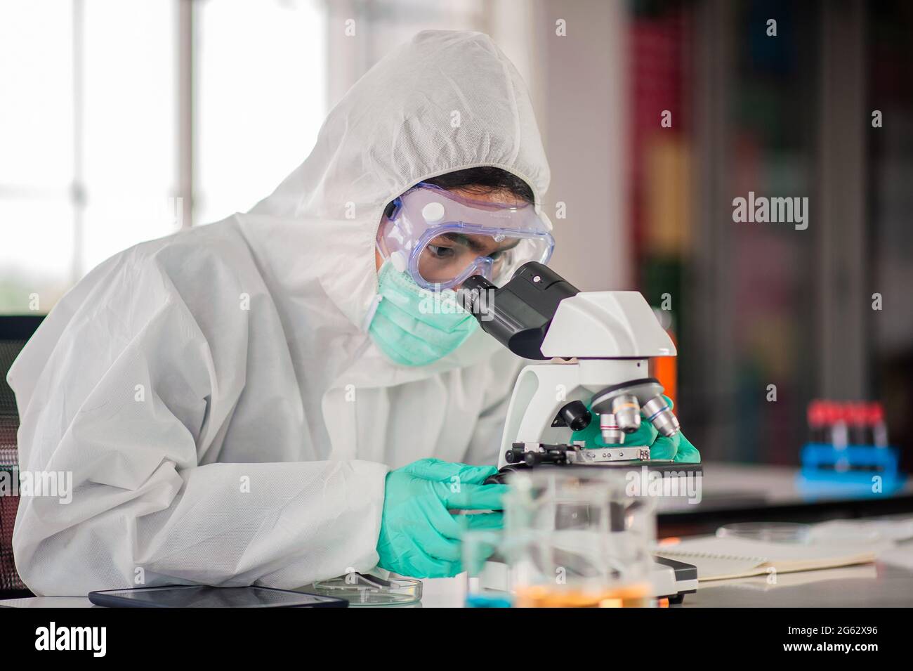 Close up Doctor using microscope in hospital lab check for germs Stock ...