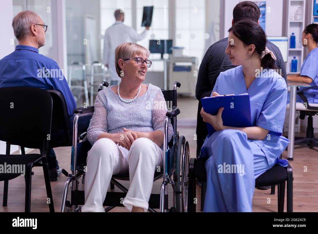 Woman filing in hospital hi-res stock photography and images - Alamy