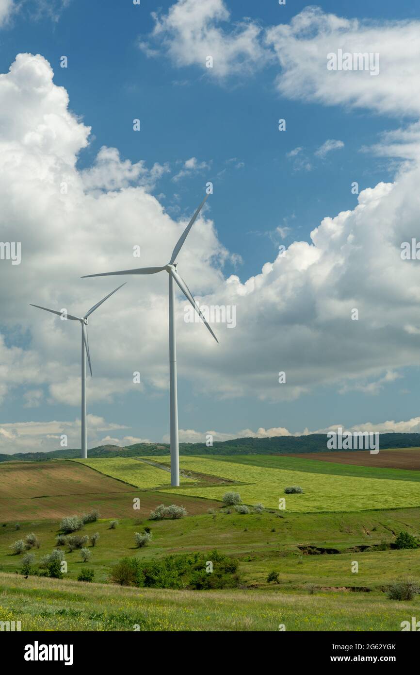 wind turbines and blue sky with clouds, concept photo Stock Photo - Alamy