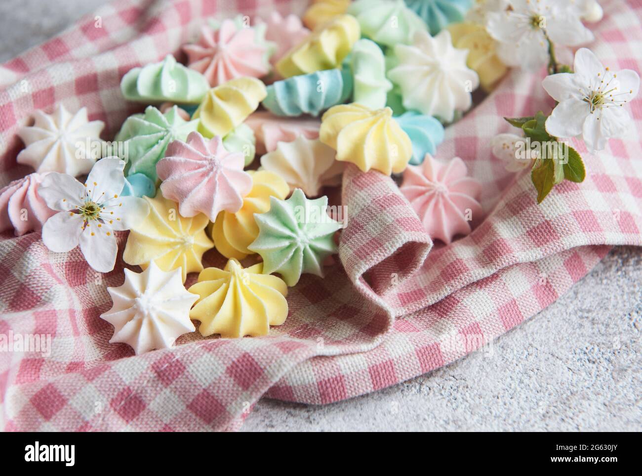 Close-up delicious meringue cookies pastel colors. French pastries ...