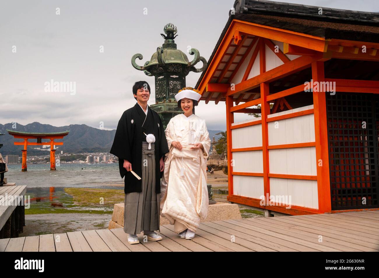 Shinto bride and groom on the Japanese Island of Miyajima with the the ...