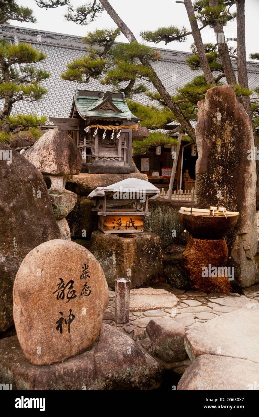 A Shinto shrine on the Japanese Island of Miyajima with a wooden ...