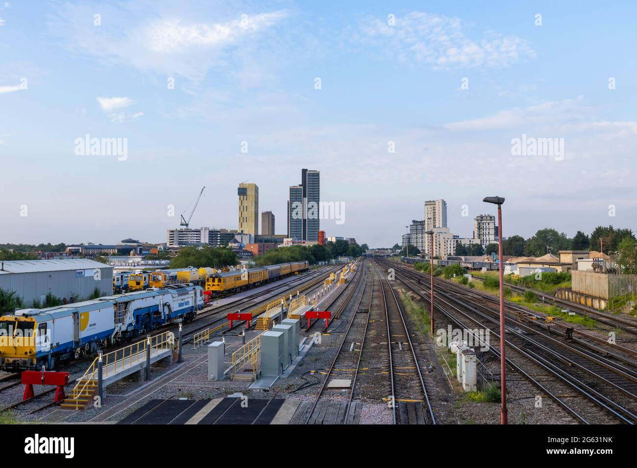 The railway and skyline with skyscraper tower blocks of the mixed use ...