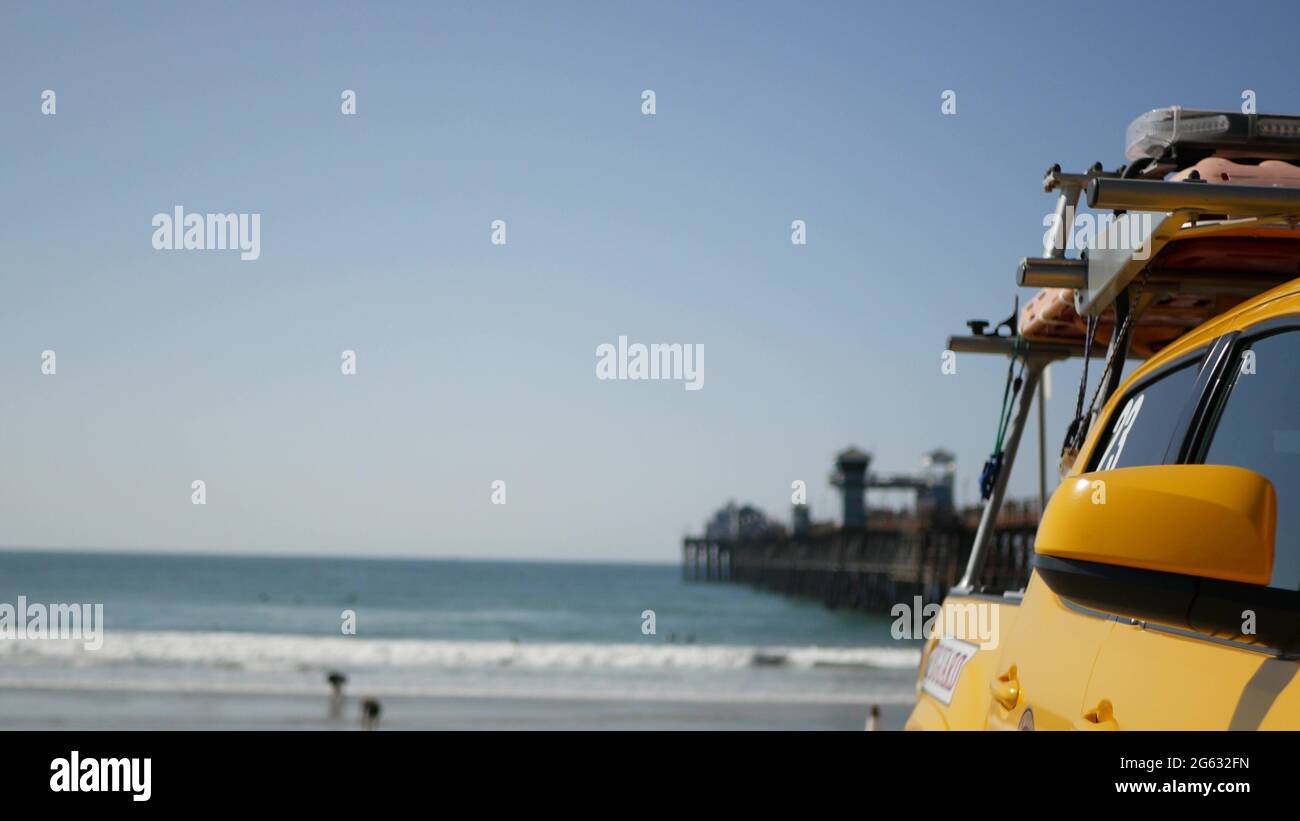 Yellow lifeguard car, Oceanside beach, California USA. Coastline rescue ...