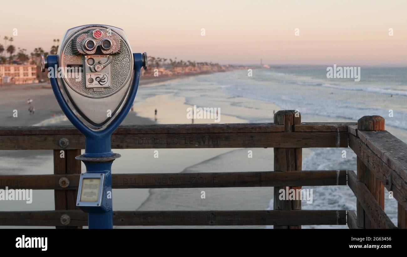Metallic stationary observation tower viewer, waterfront old binoculars ...