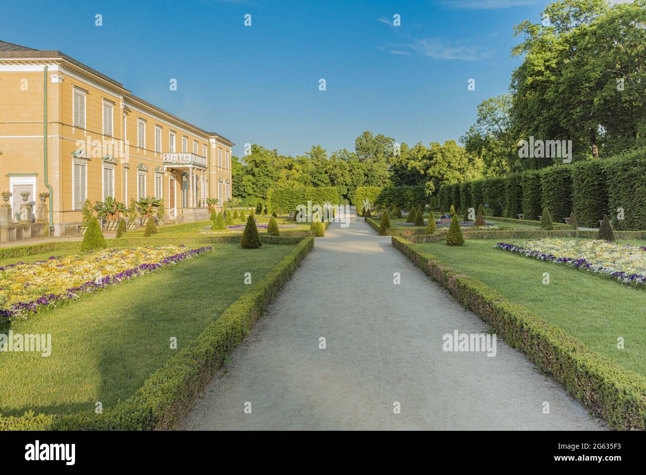 A beautiful landscape of a city park with paths, flower beds and trees ...