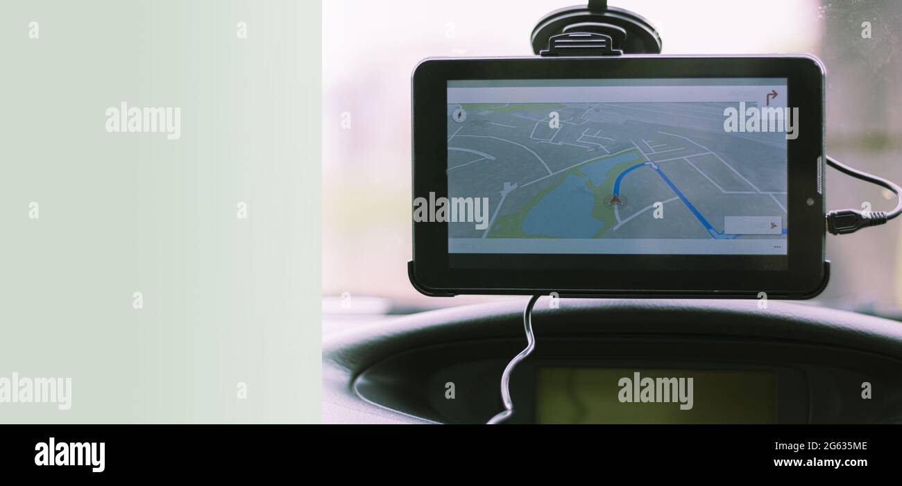Navigator on the windshield of the car. GPS navigation device in the ...