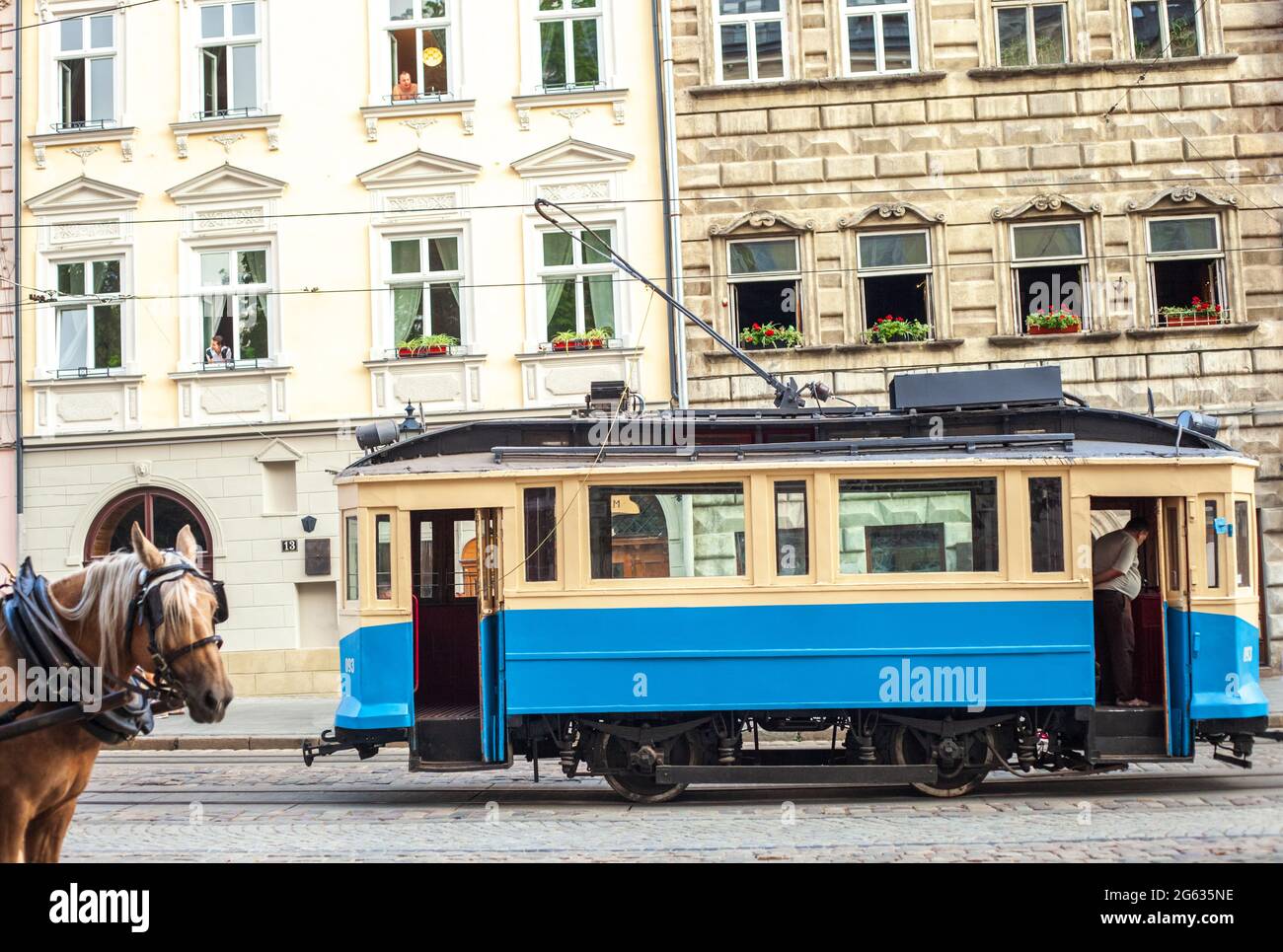 Vintage old tram and horse at old town market square in Lviv, Ukraine ...