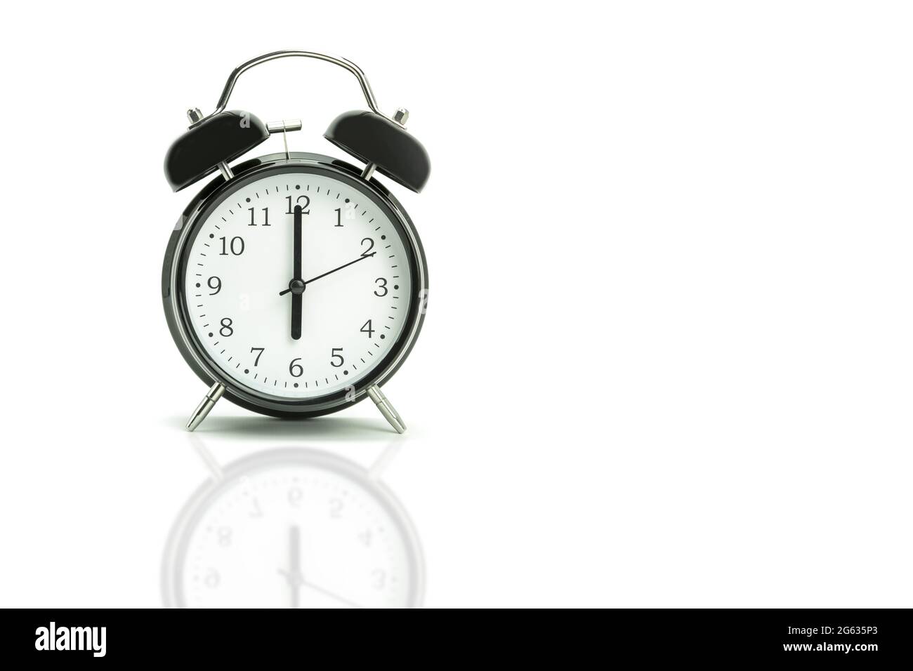 Retro alarm clock on a white background. Black alarm clock showing 6 ...
