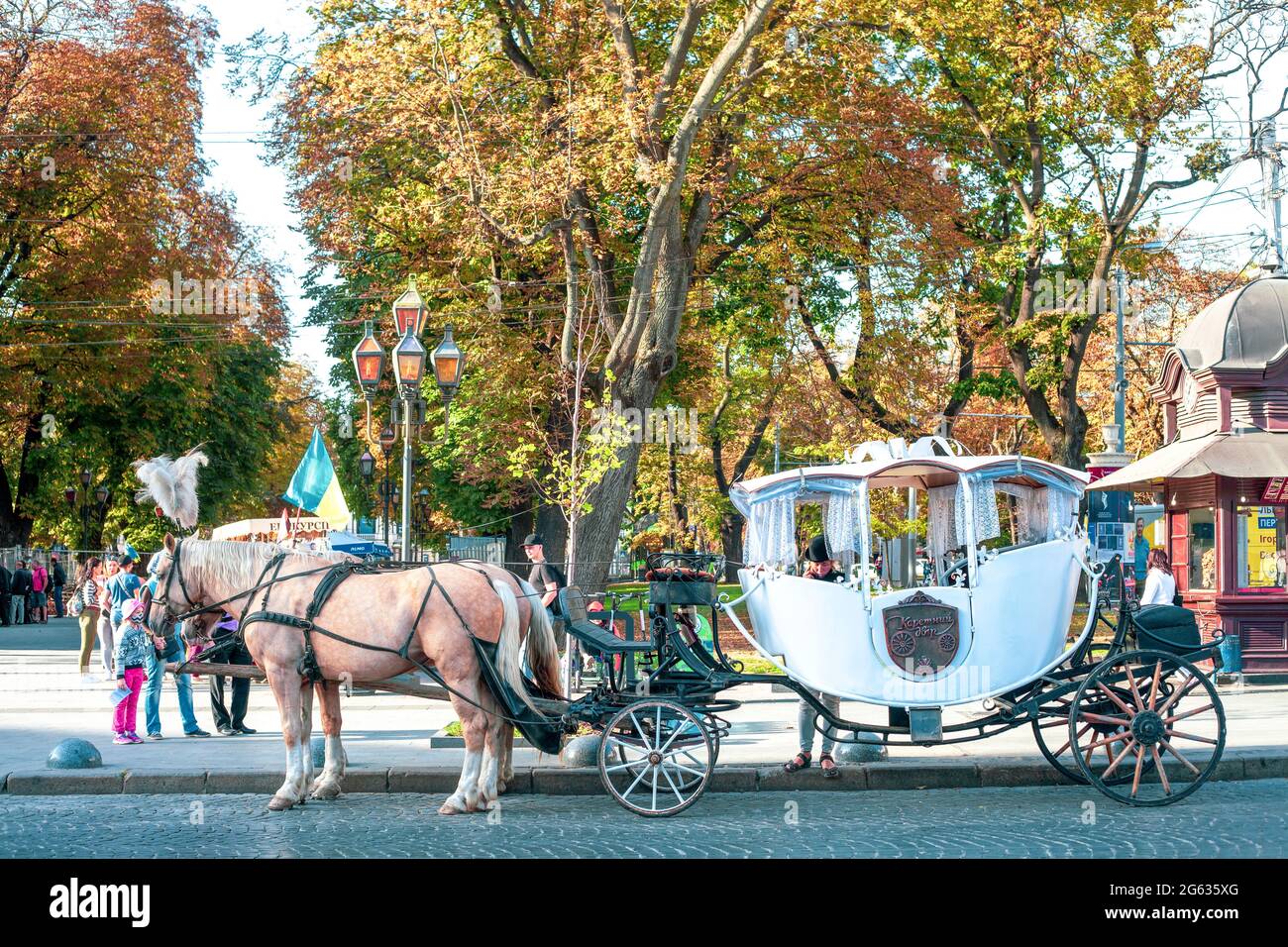 Lviv, Ukraine - 19 September 2020: Horse carriage and walking tourists ...