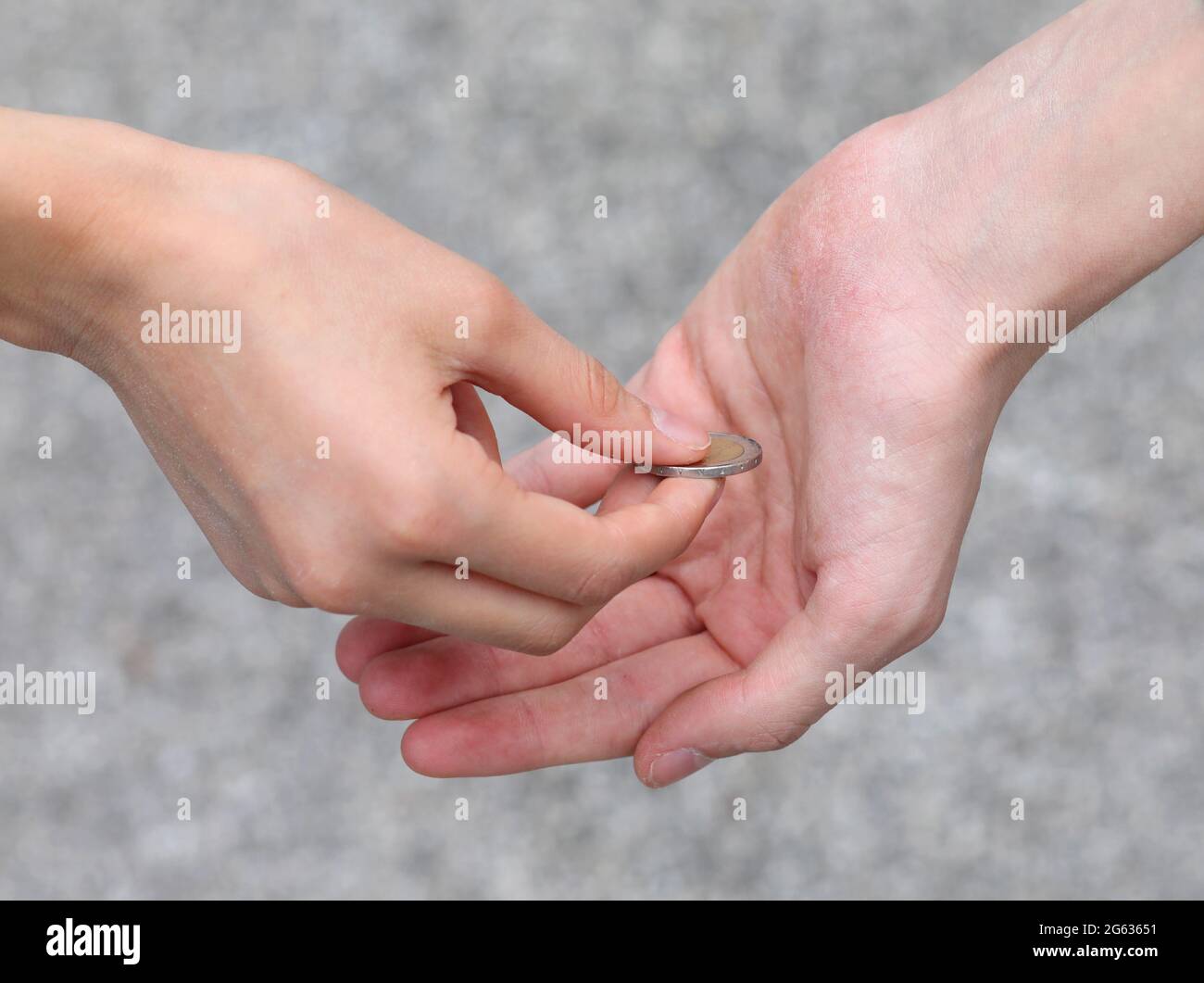 Child giving alms hi-res stock photography and images - Alamy