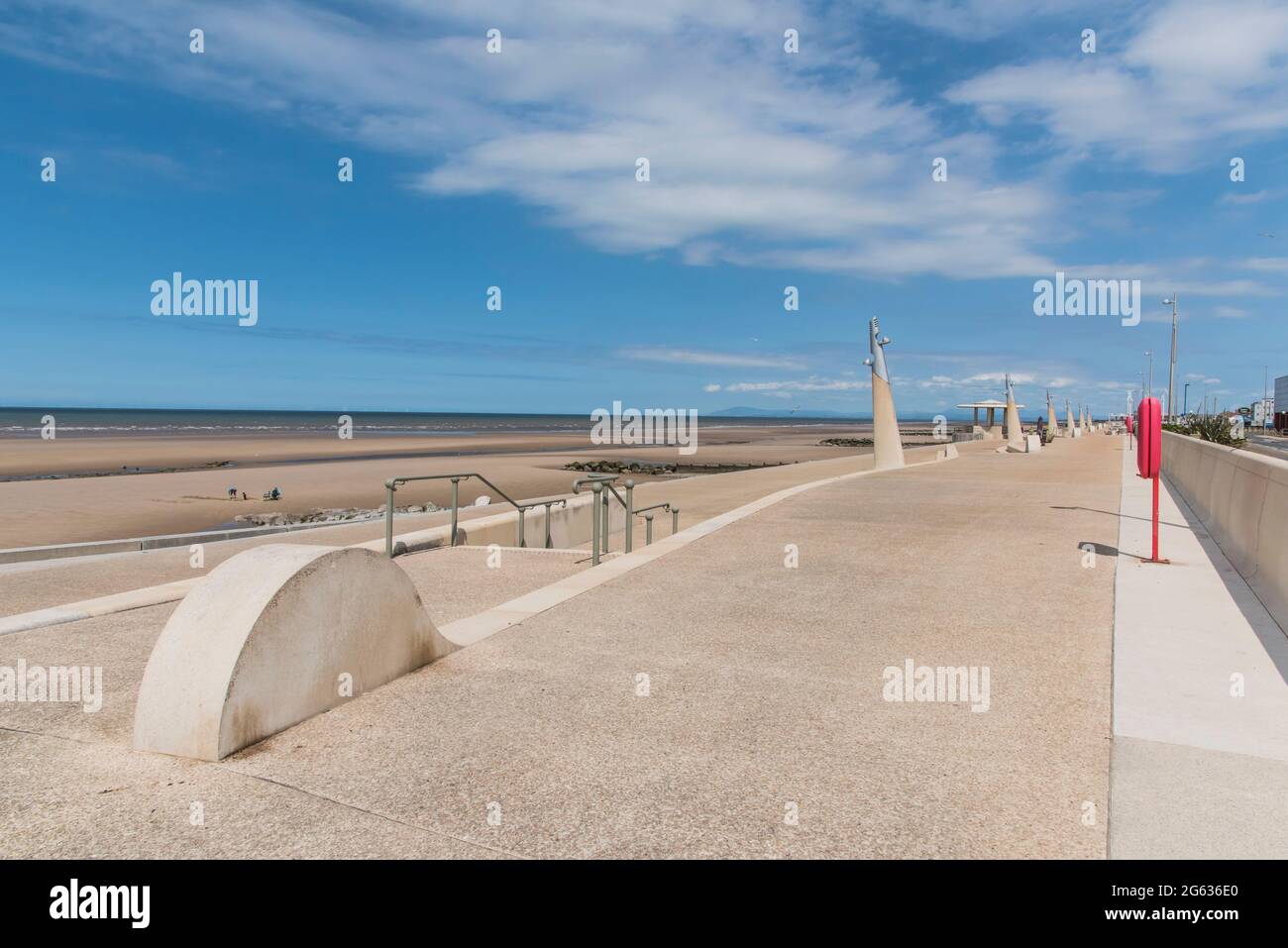 The image is of the seafront promenade with impressive lighting columns ...