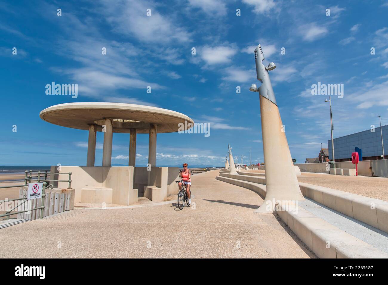 The image is of the seafront promenade with impressive lighting columns ...